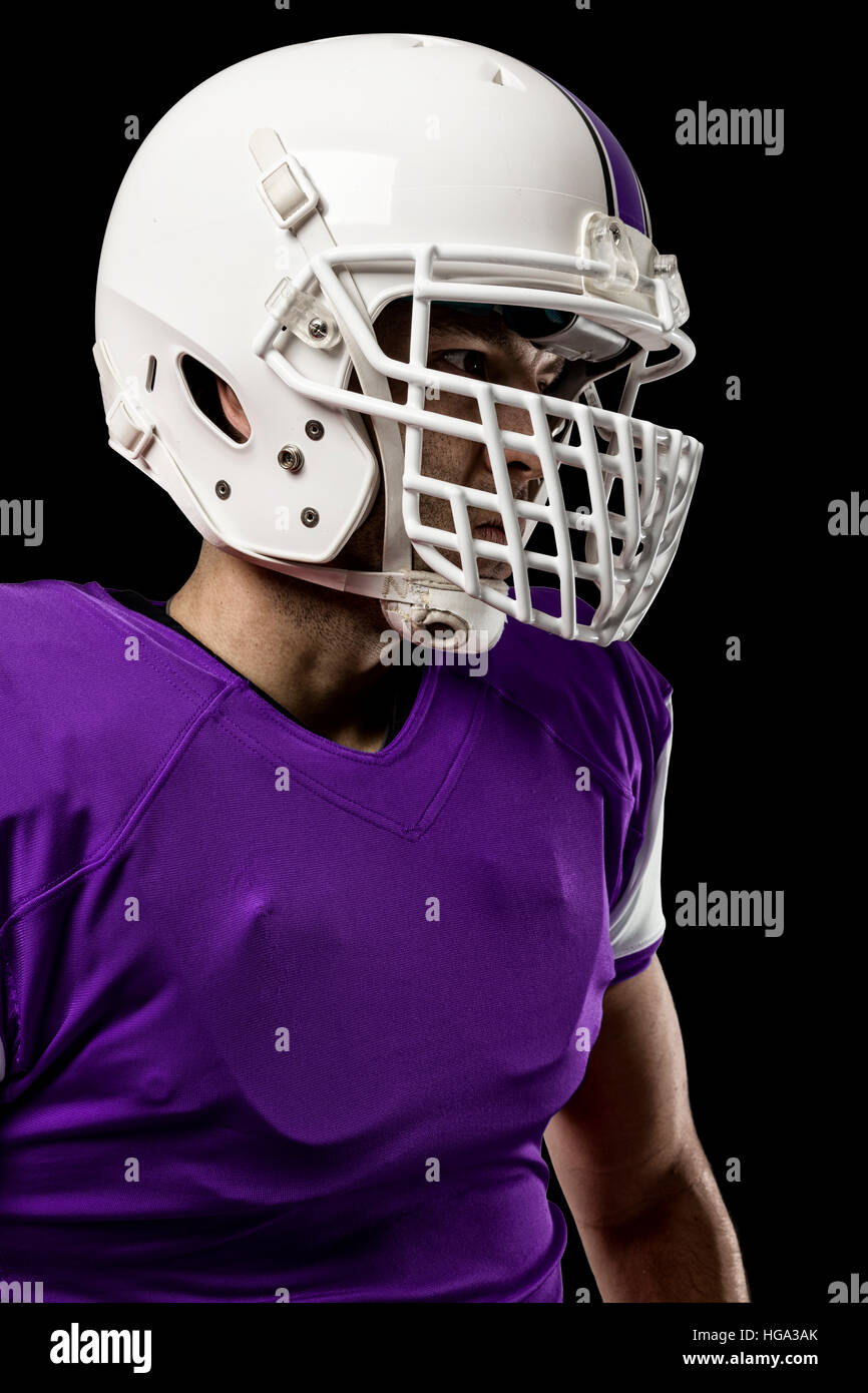 Close up of a Football Player with a purple uniform on a black ...