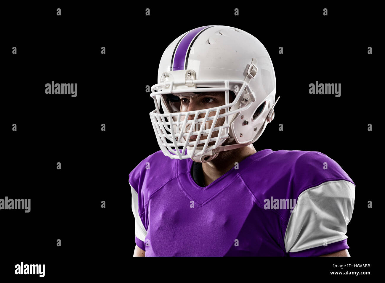 Close up of a Football Player with a purple uniform on a black ...