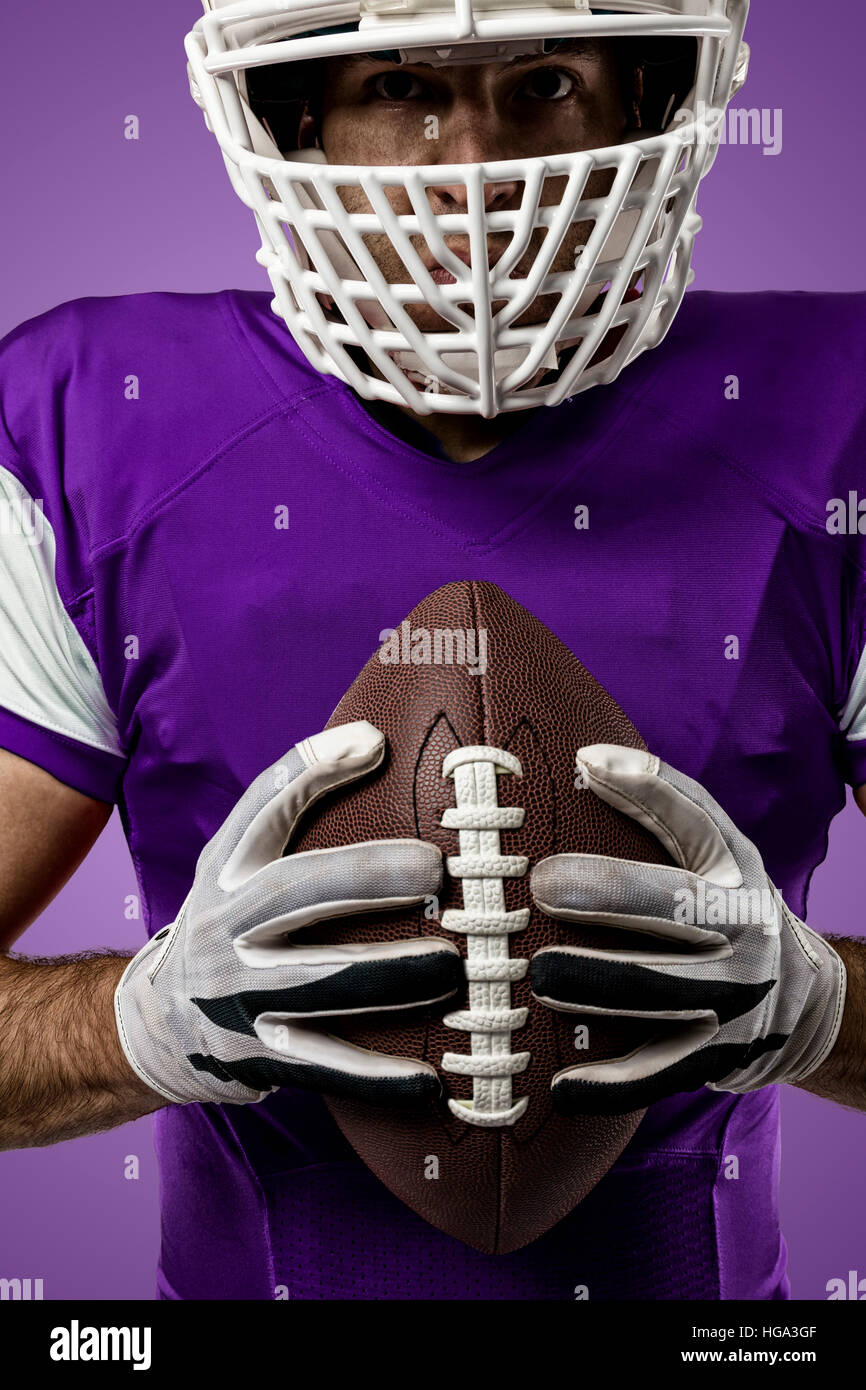 Close up of a Football Player with a purple uniform on a purple ...