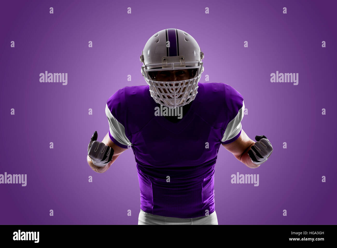 Football Player with a purple uniform on a purple background Stock ...
