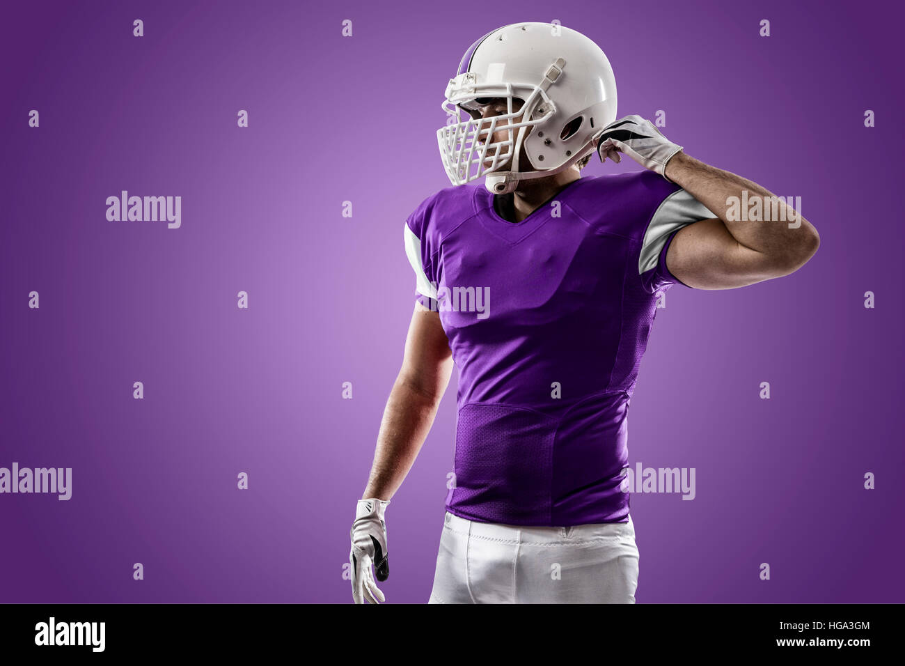 Football Player with a purple uniform on a purple background Stock ...
