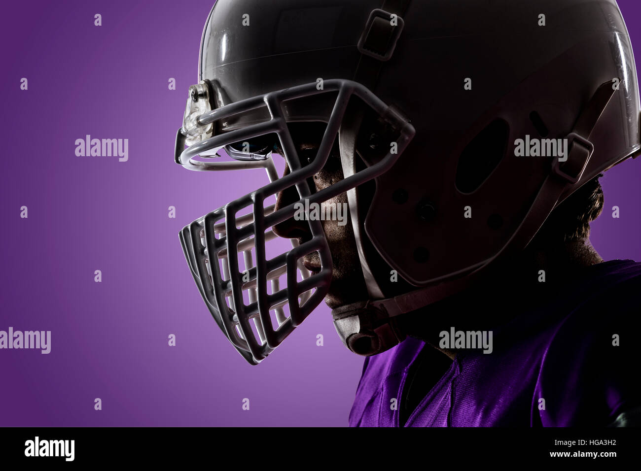 Close up of a Football Player with a purple uniform on a purple ...