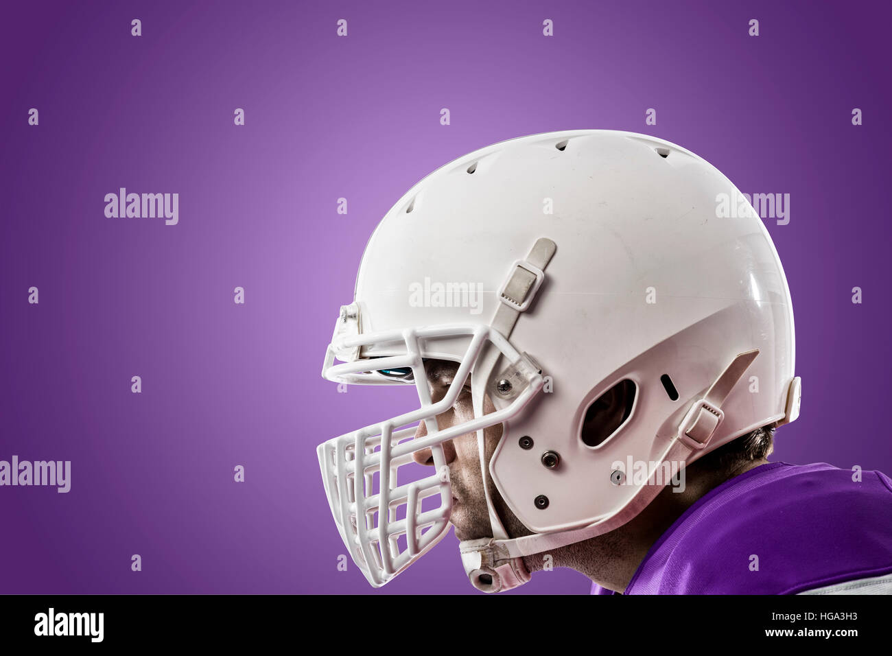 Close up of a Football Player with a purple uniform on a purple ...