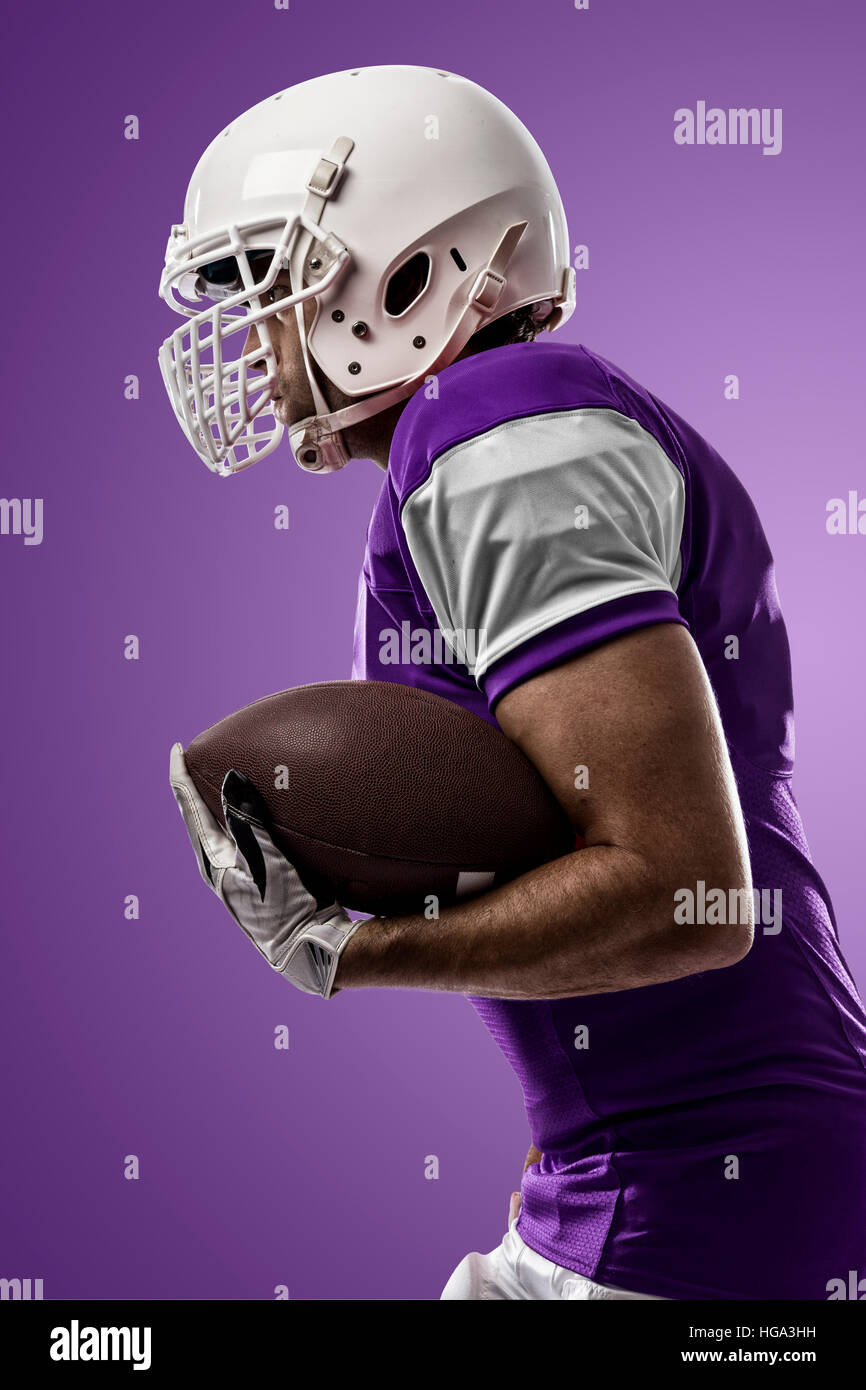 Football Player with a purple uniform Running on a purple background ...