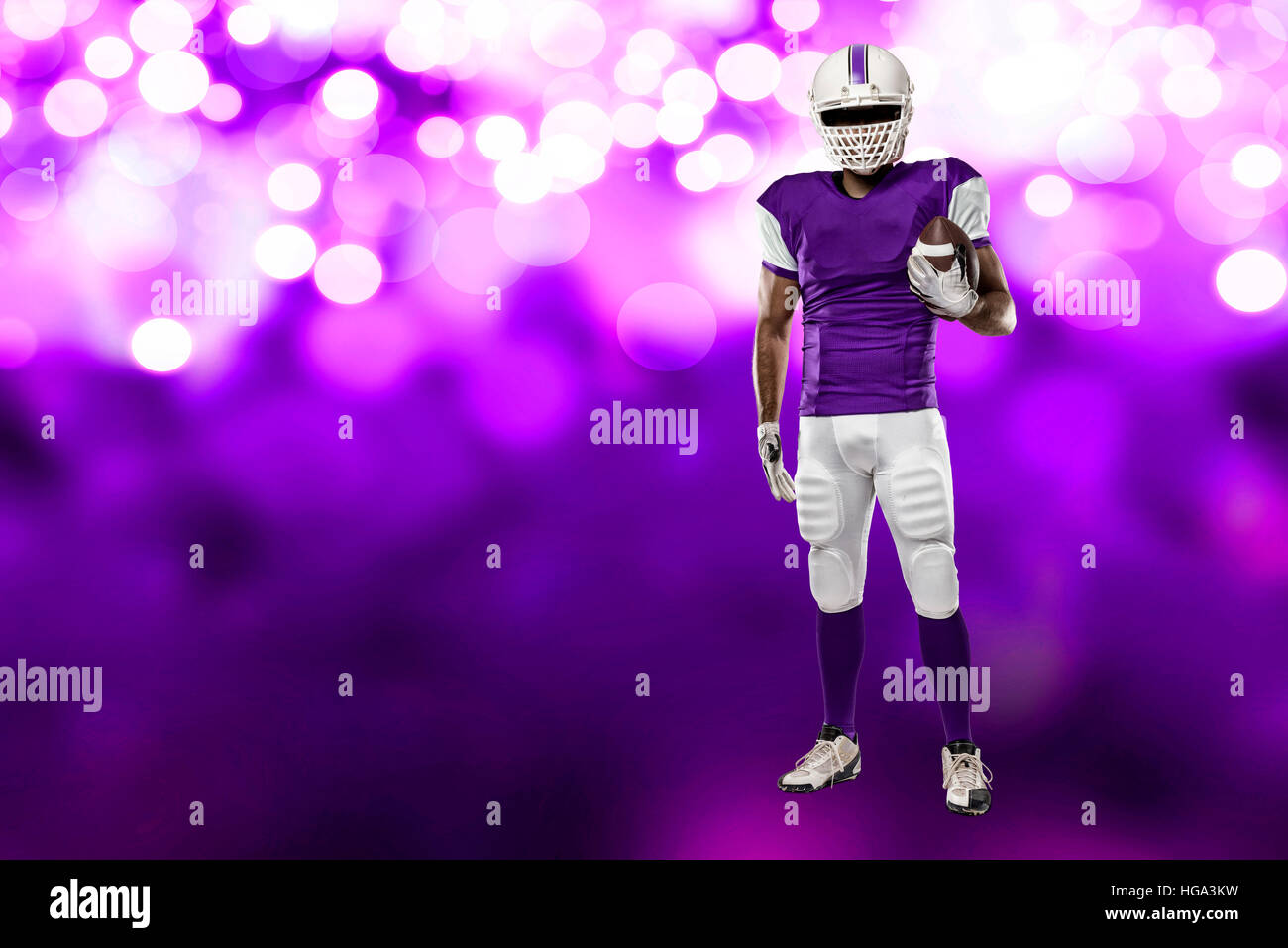 Football Player with a purple uniform on a purple lights background ...