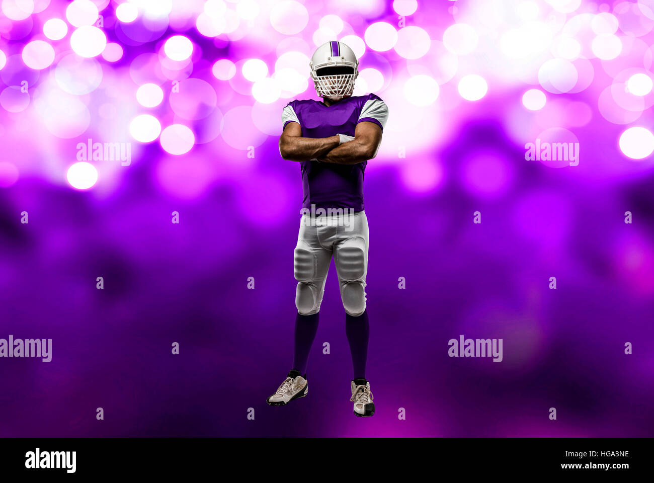 Football Player with a purple uniform on a purple lights background ...