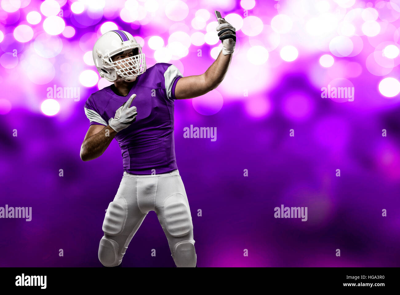 Football Player with a purple uniform making a selfie on a purple ...