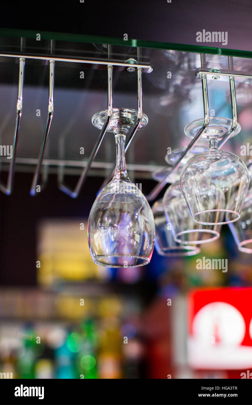 glasses in shelf above a bar rack in restaurant Stock Photo - Alamy