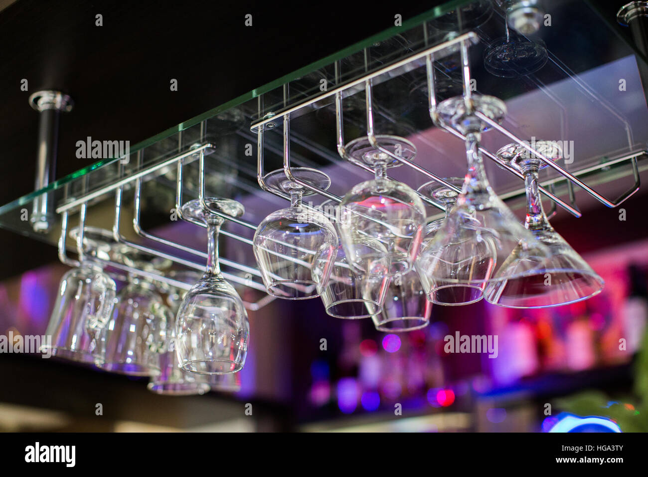 glasses in shelf above a bar rack in restaurant Stock Photo - Alamy