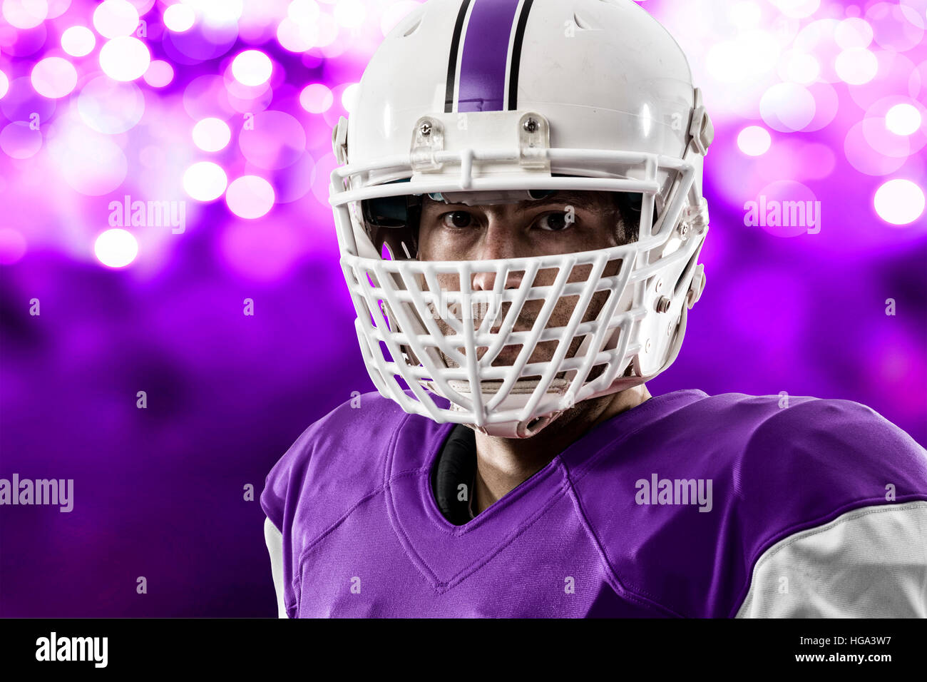 Close up of a Football Player with a purple uniform on a purple lights ...