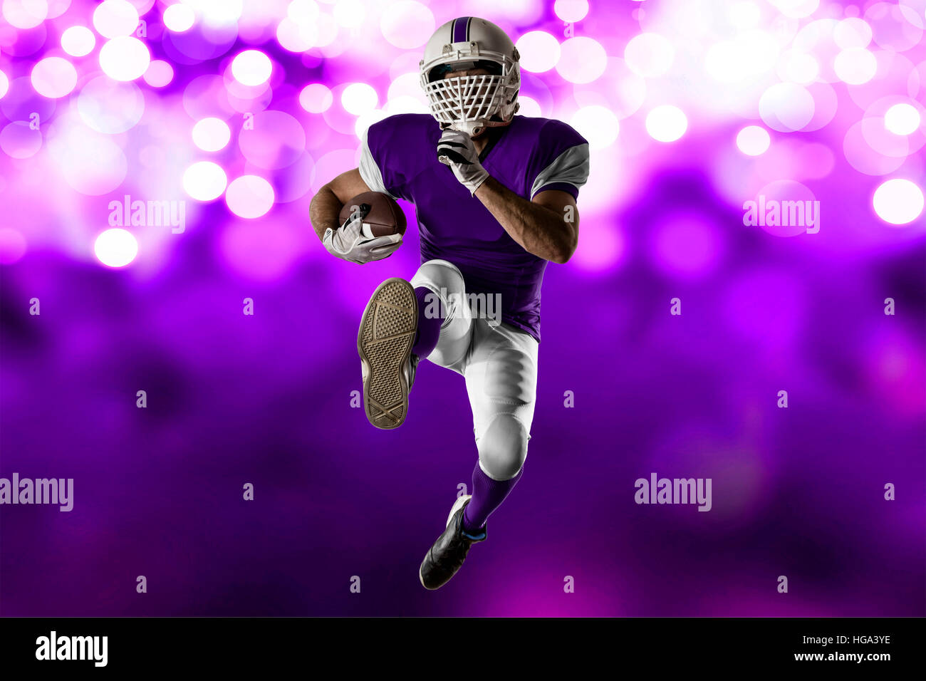 Football Player with a purple uniform Running on a purple lights ...