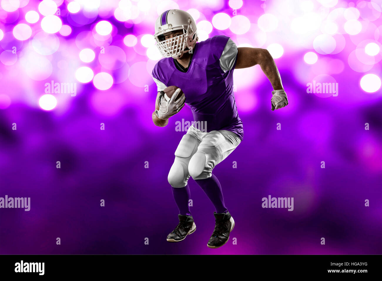 Football Player with a purple uniform Running on a purple lights ...
