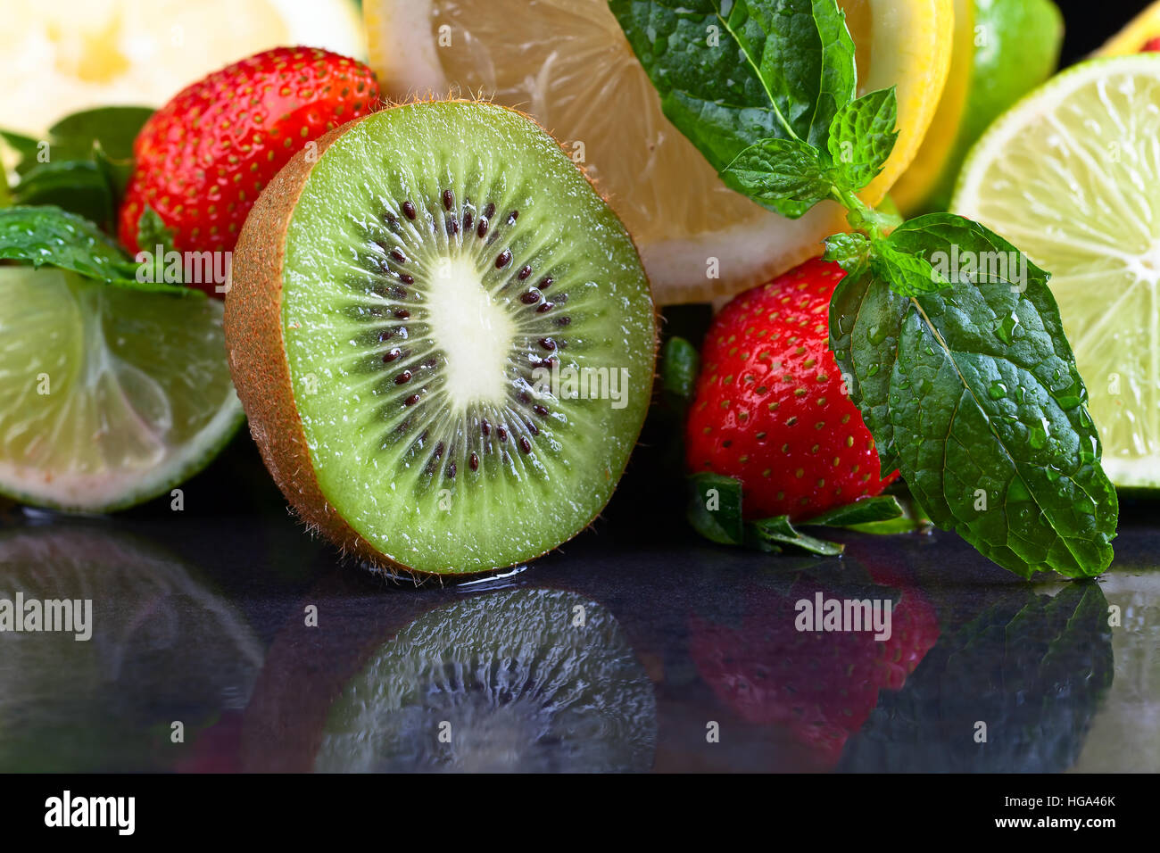 The ripe juicy fruits and peppermint leaves Stock Photo - Alamy