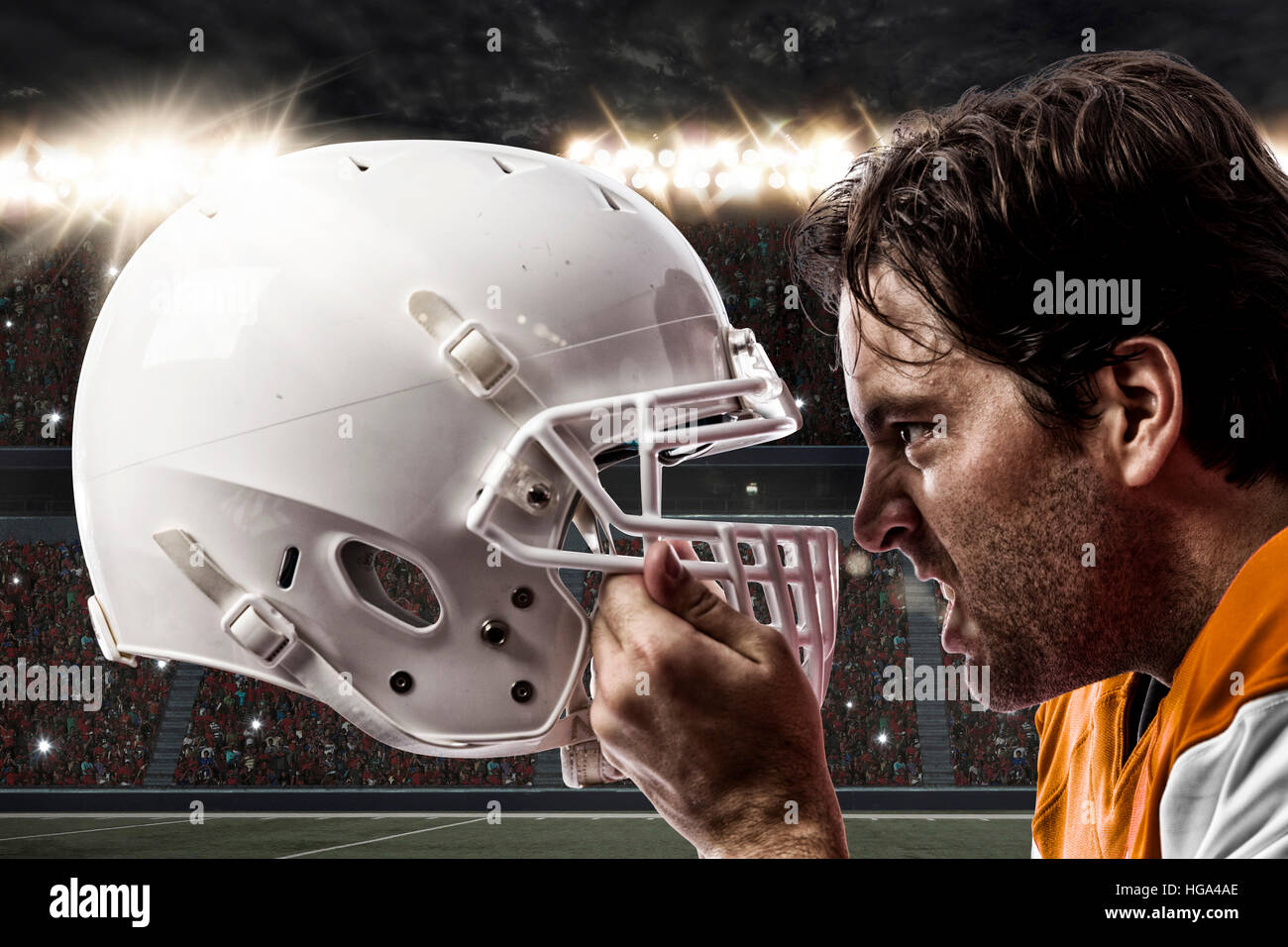 Close up of a Football orange with a white uniform on a stadium Stock ...