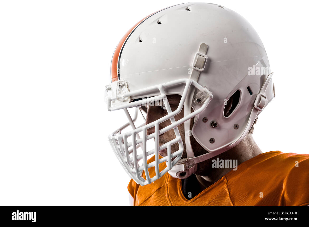 Close up of a Football Player with a orange uniform on a white ...