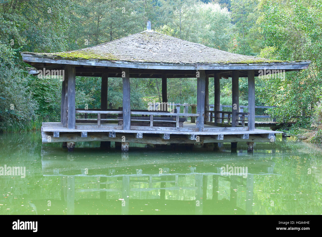 Old wooden house on the pond Stock Photo - Alamy
