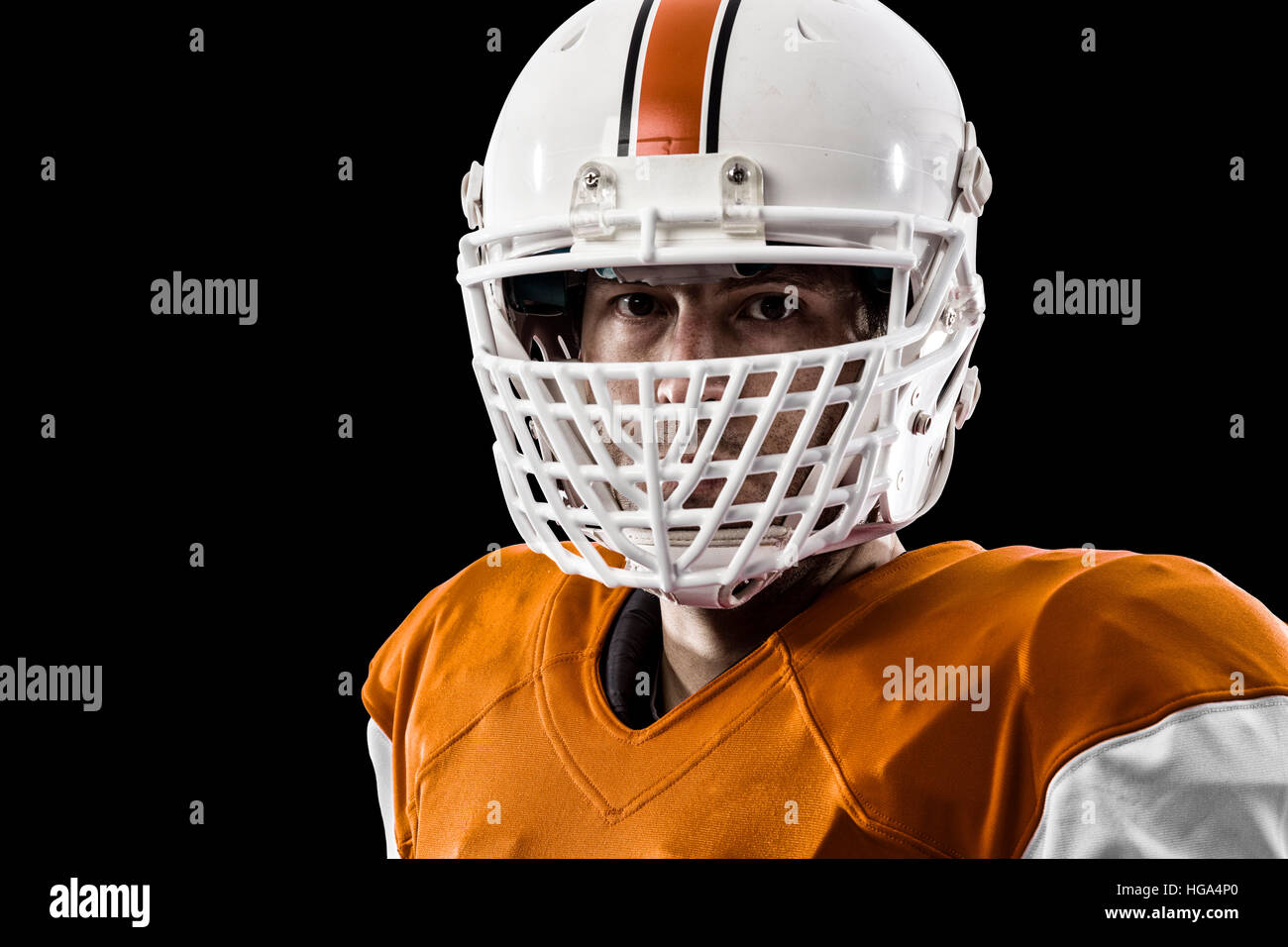 Close up of a Football Player with a orange uniform on a black ...