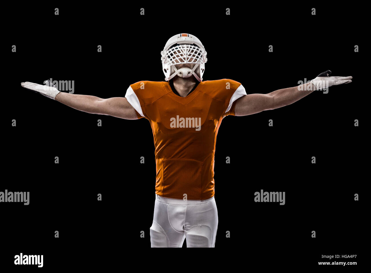 Football Player with a orange uniform celebrating, on a black ...