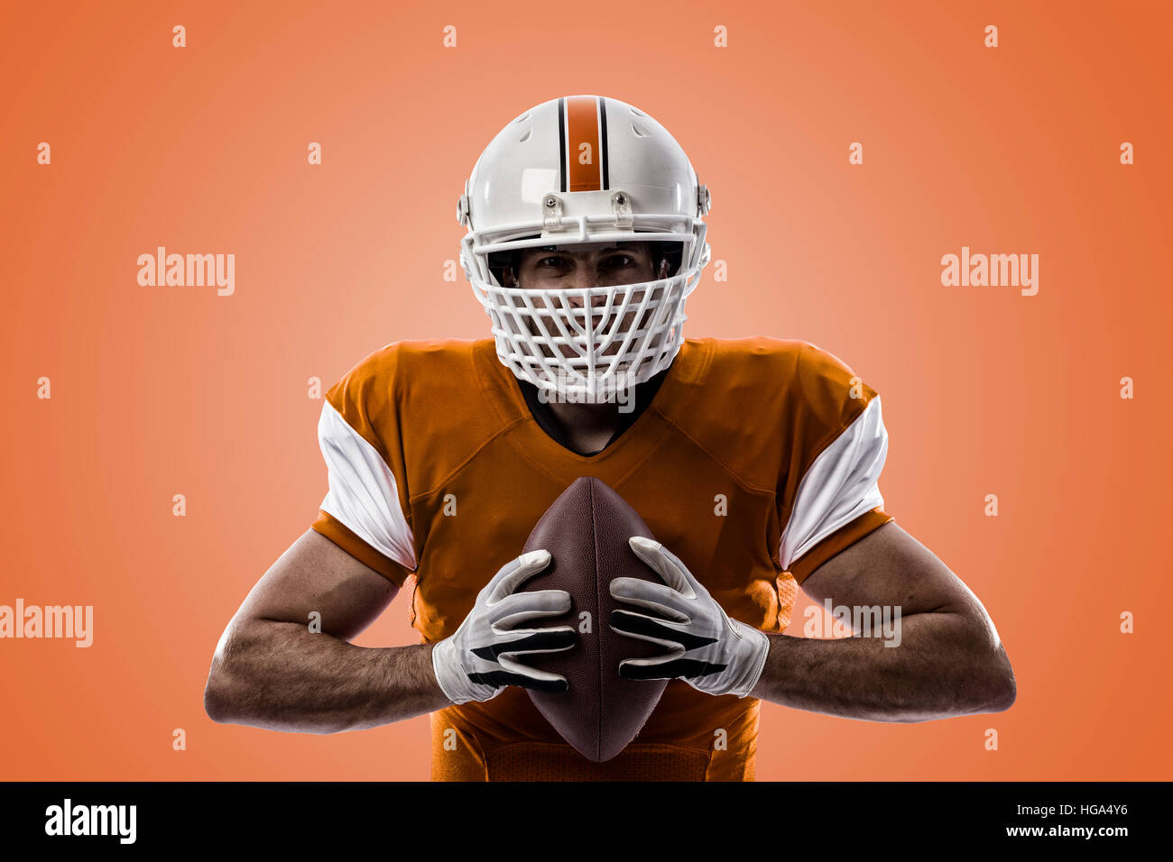 Football Player with a orange uniform on a orange background Stock ...