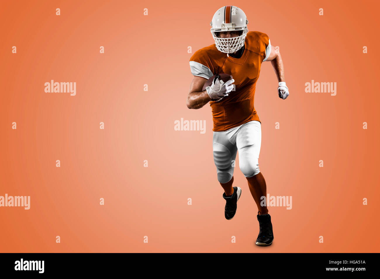 Football Player with a orange uniform Running on a orange background ...