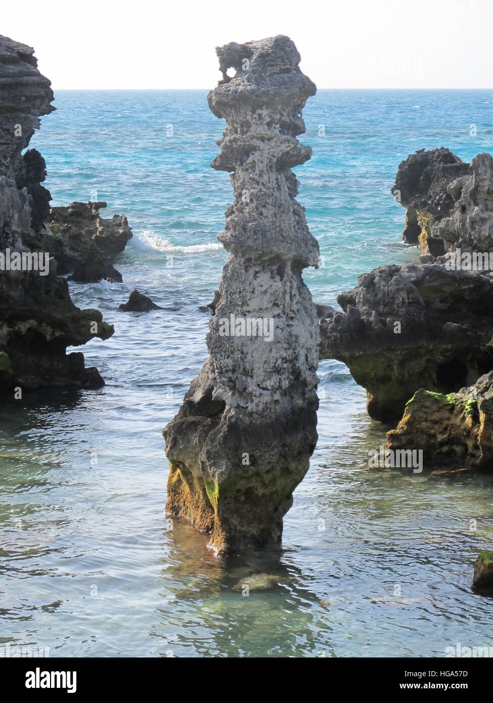 A lime stone sea stack in the Caribbean sea Stock Photo - Alamy