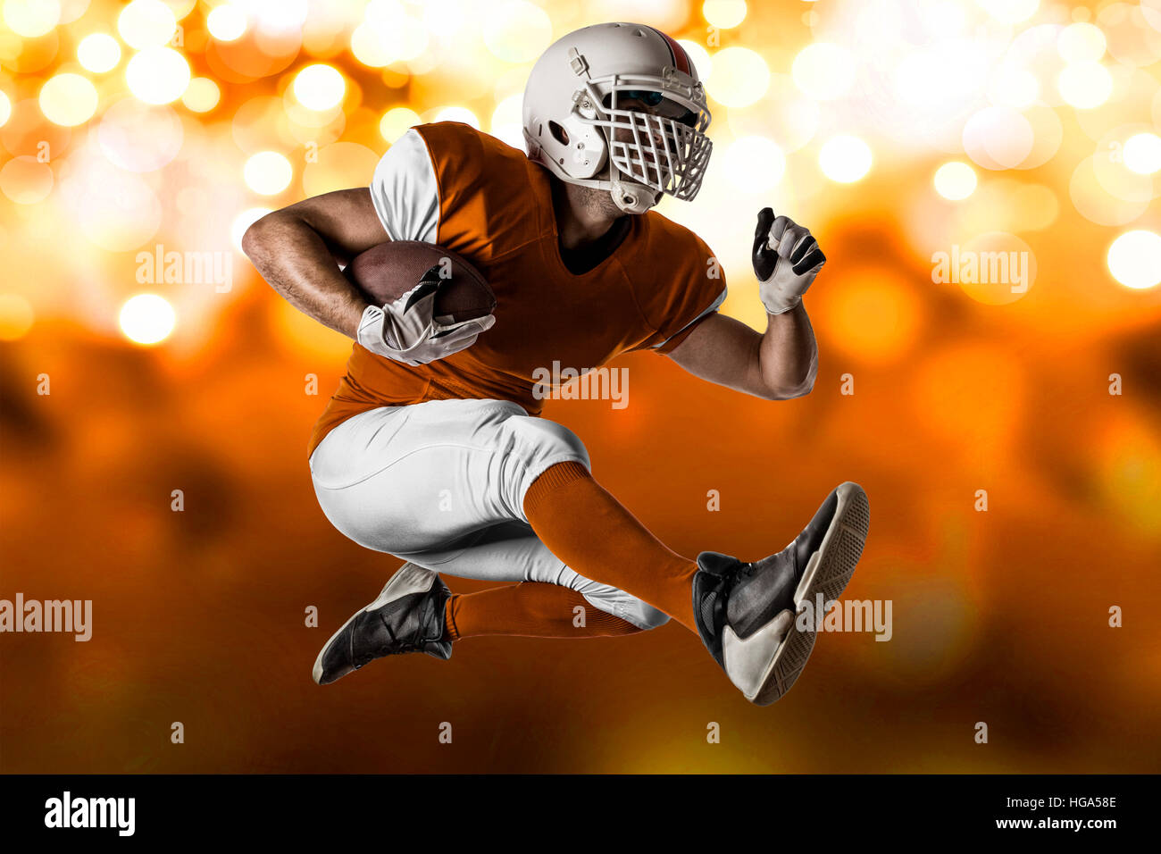 Football Player with a orange uniform Running on a orange lights ...