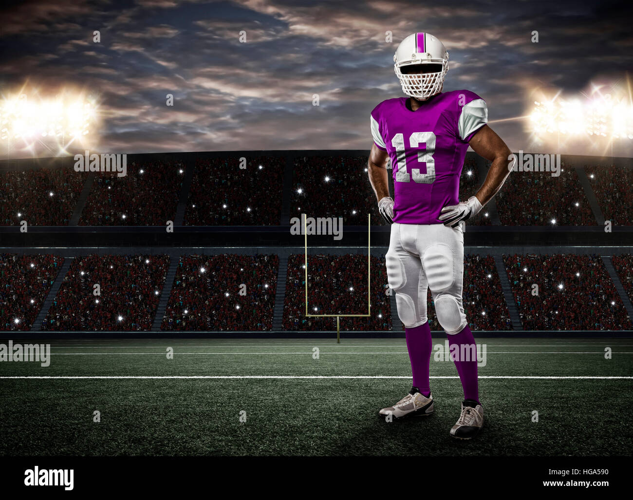 Football Player with a pink uniform on a stadium Stock Photo - Alamy
