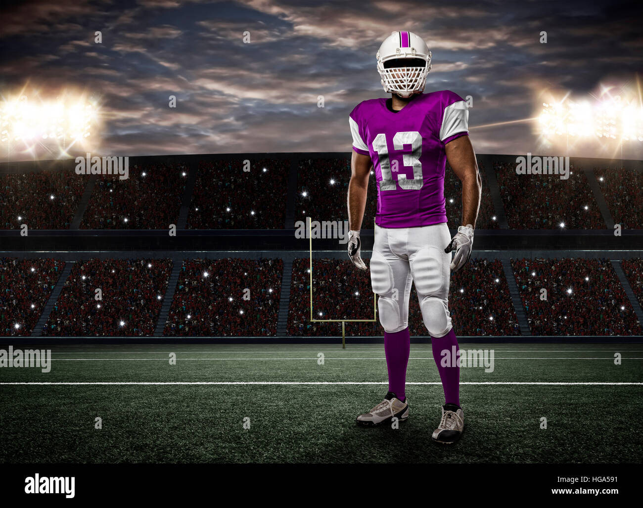 Football Player with a pink uniform on a stadium Stock Photo - Alamy