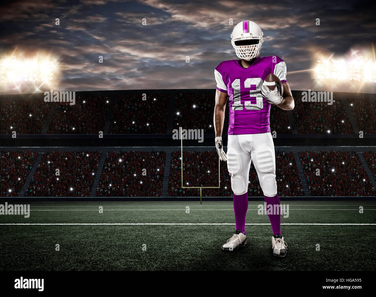 Football Player with a pink uniform on a stadium Stock Photo - Alamy