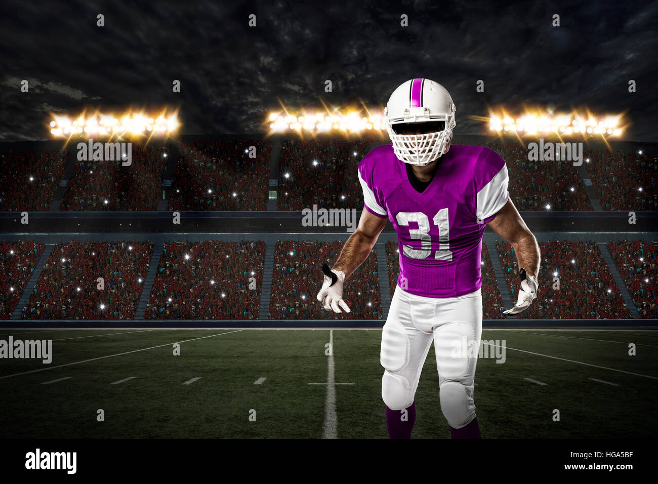 Football Player with a pink uniform on a stadium Stock Photo - Alamy