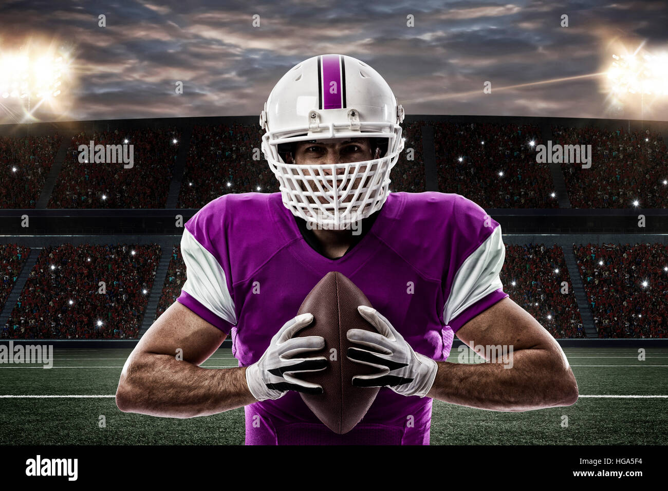 Football Player with a pink uniform on a stadium Stock Photo - Alamy