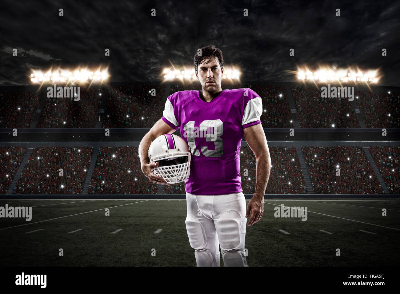 Football Player with a pink uniform on a stadium Stock Photo - Alamy