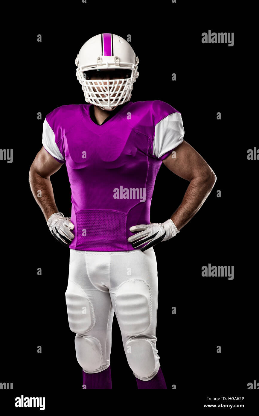 Football Player with a pink uniform on a black background Stock Photo ...