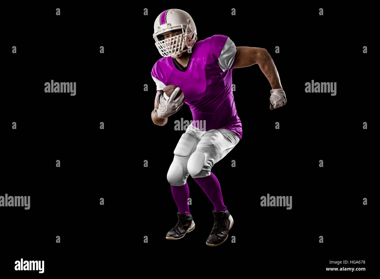 Football Player with a pink uniform Running on a black background Stock ...