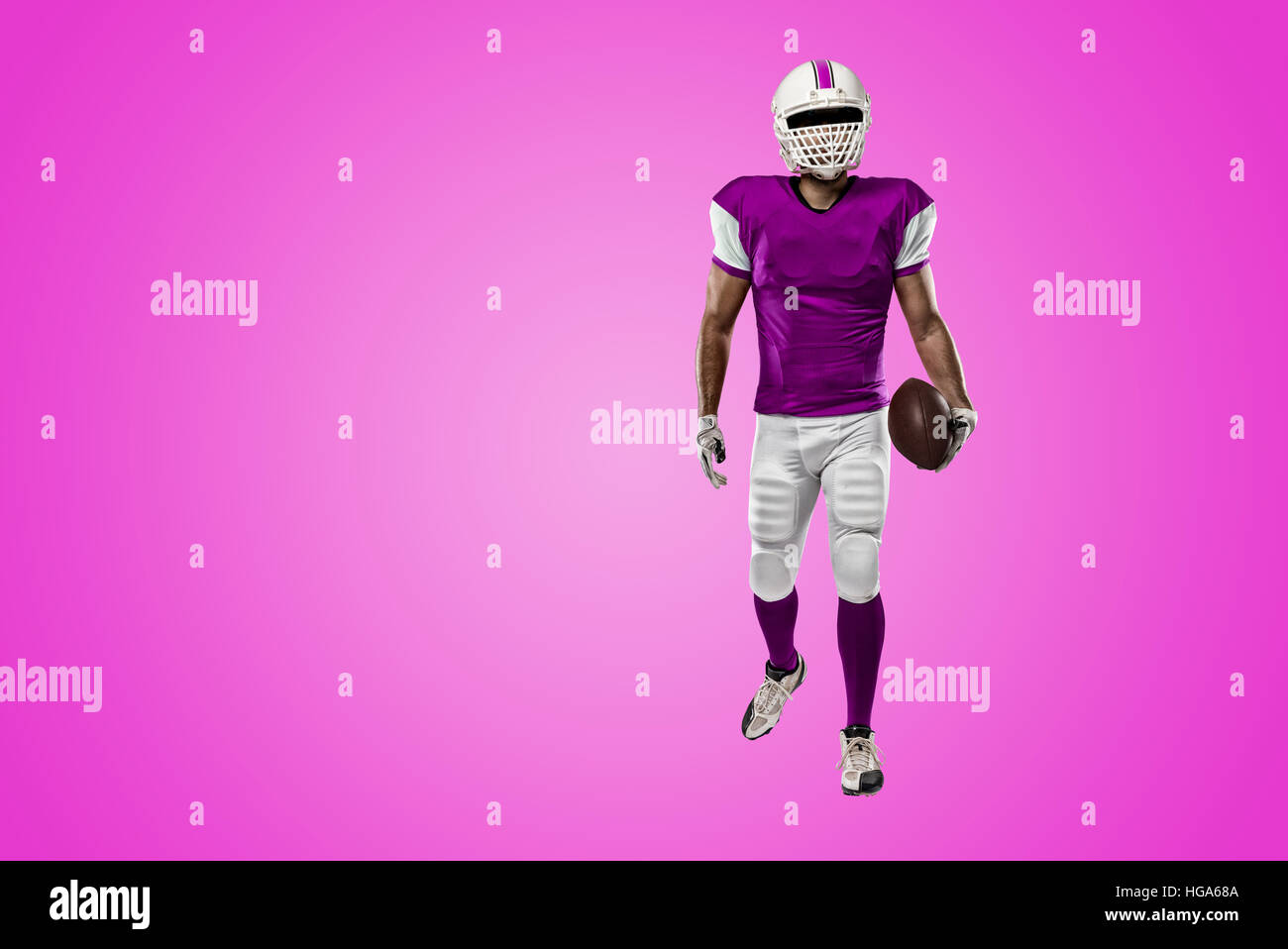Football Player with a pink uniform on a pink background Stock Photo ...
