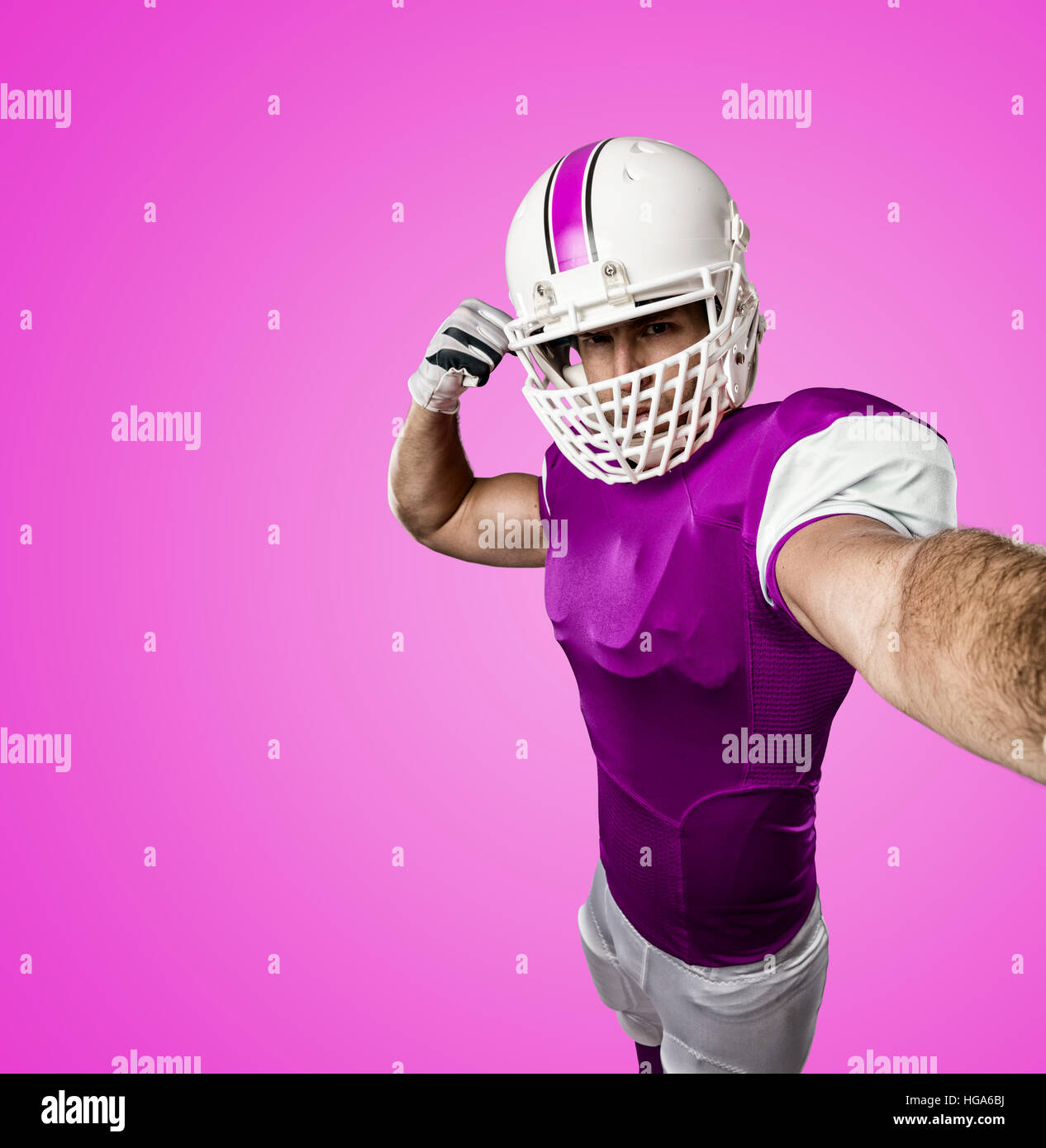 Football Player with a pink uniform making a selfie on a pink ...