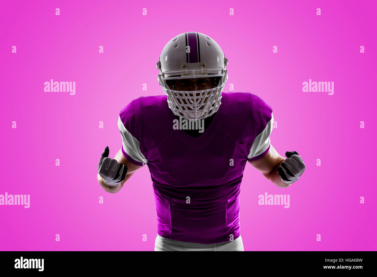 Football Player with a pink uniform on a pink background Stock Photo ...