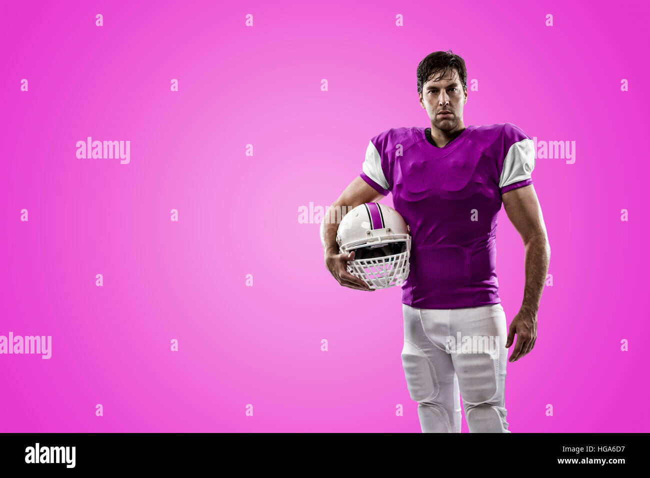 Football Player with a pink uniform on a pink background Stock Photo ...