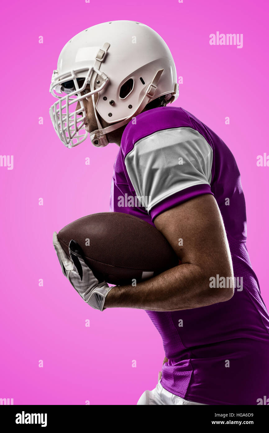 Football Player with a pink uniform Running on a pink background Stock ...