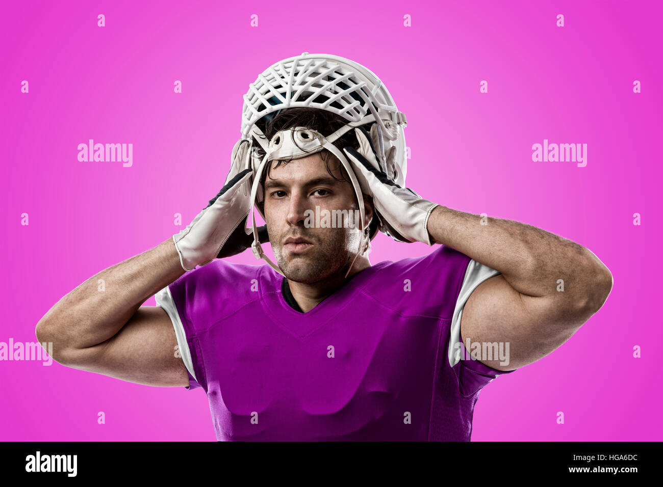 Football Player with a pink uniform on a pink background Stock Photo ...