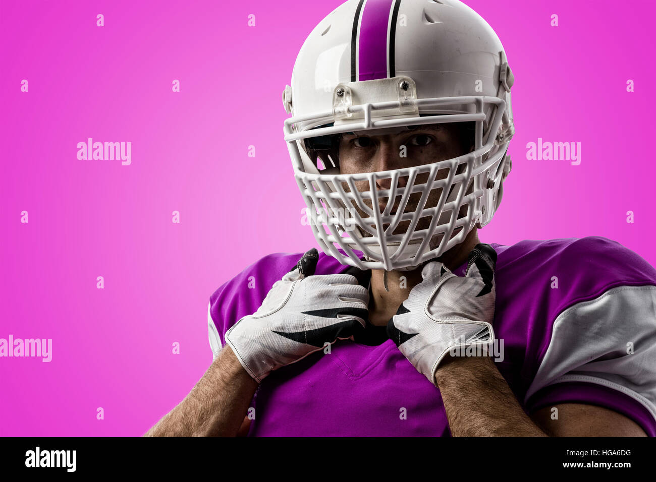 Football Player with a pink uniform on a pink background Stock Photo ...