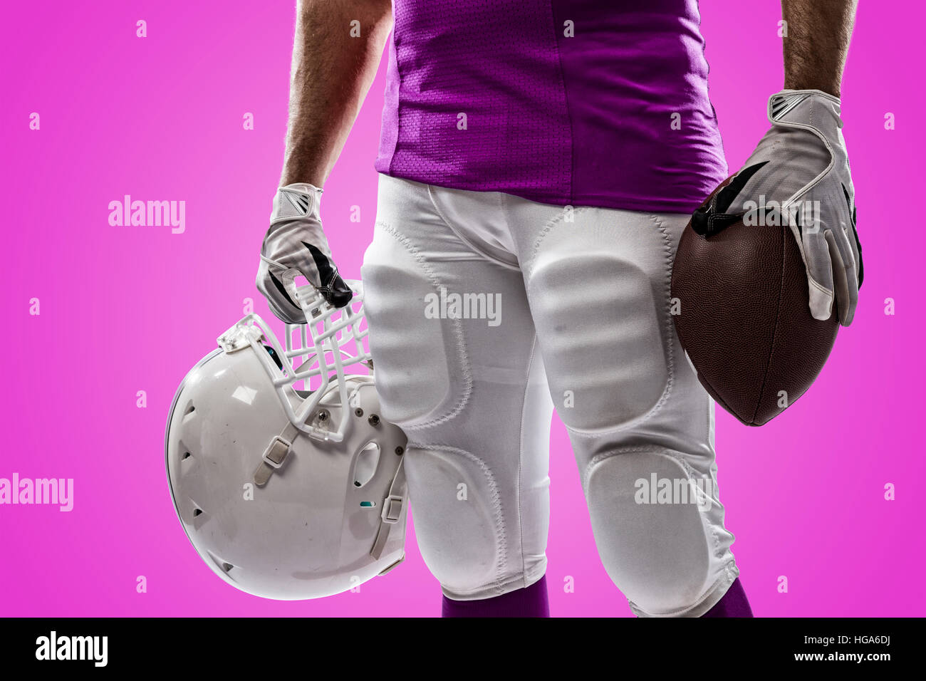 Football Player with a pink uniform on a pink background Stock Photo ...