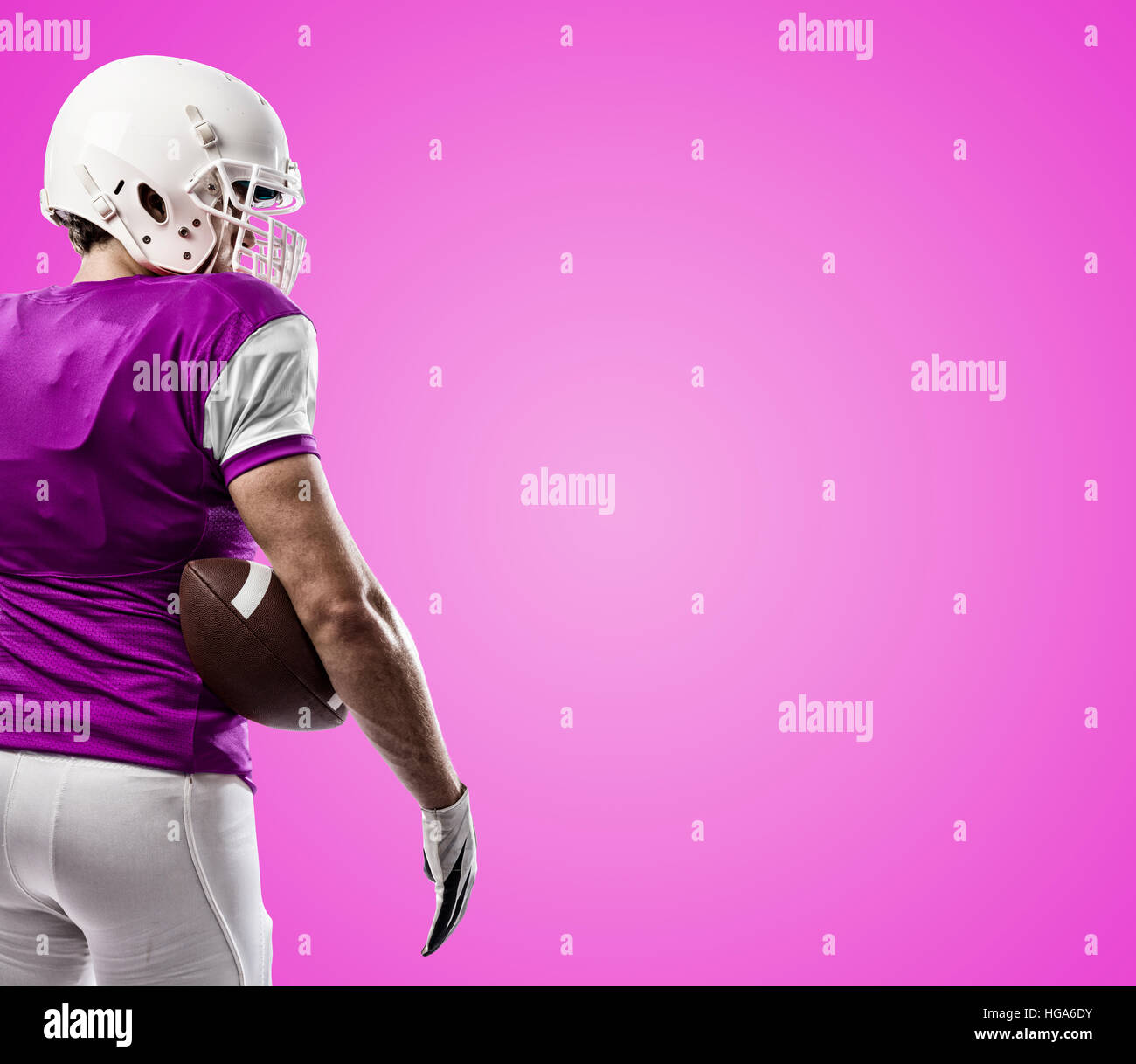 Football Player with a pink uniform on a pink background Stock Photo ...
