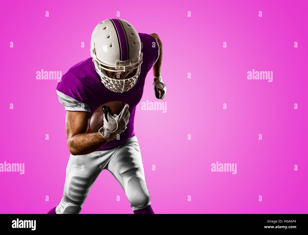 Football Player with a pink uniform Running on a pink background Stock ...