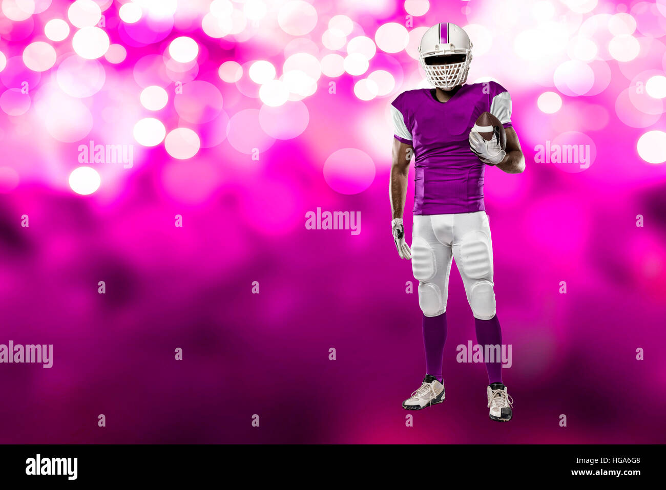 Football Player with a pink uniform on a pink lights background Stock ...