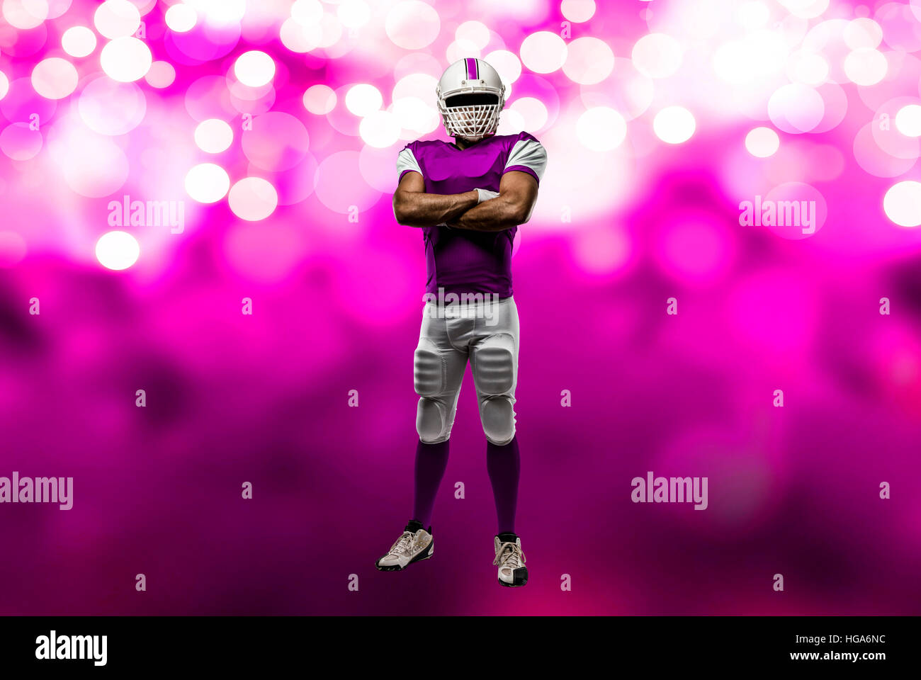 Football Player with a pink uniform on a pink lights background Stock ...