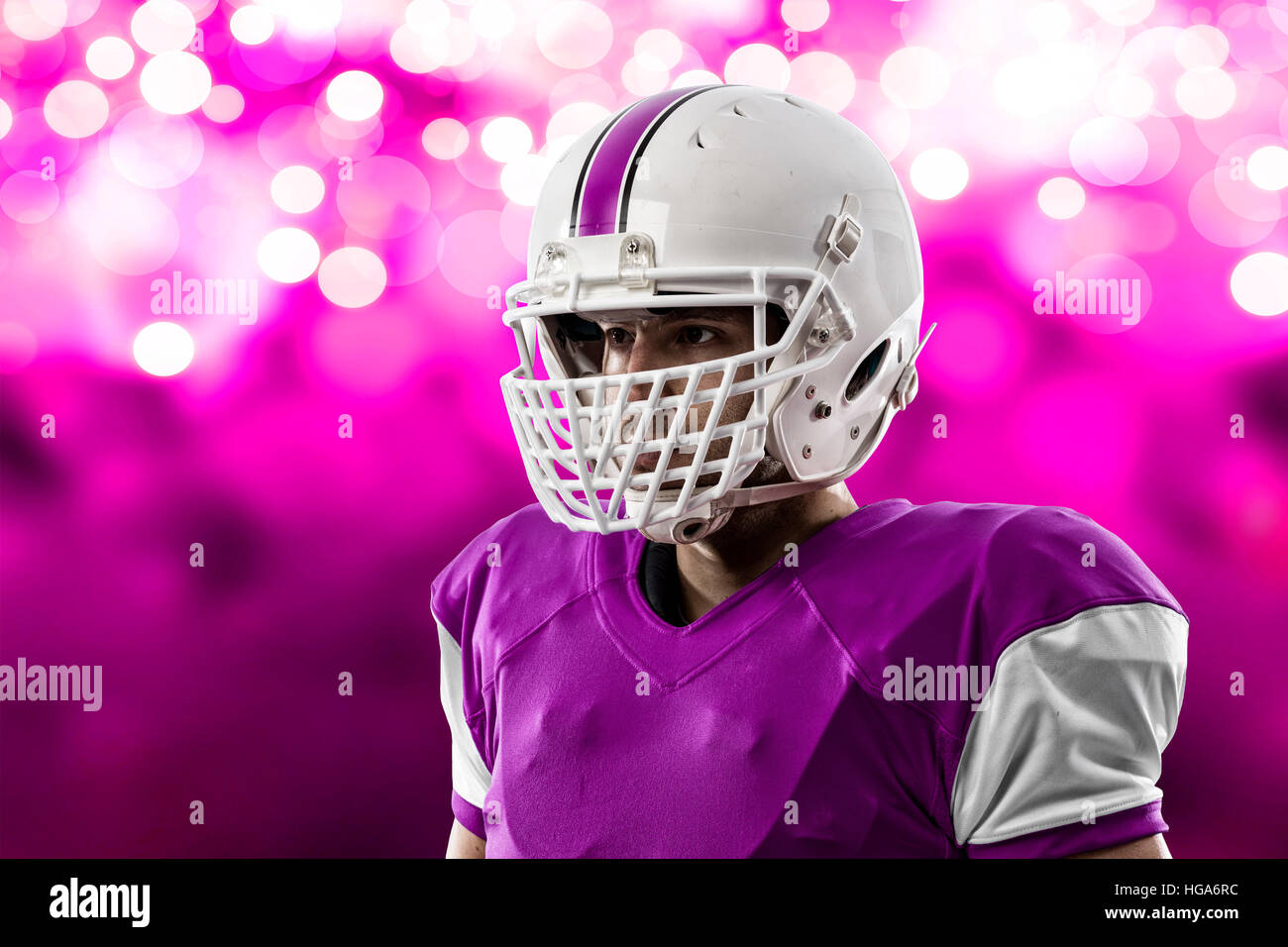 Close up of a Football Player with a pink uniform on a pink lights ...