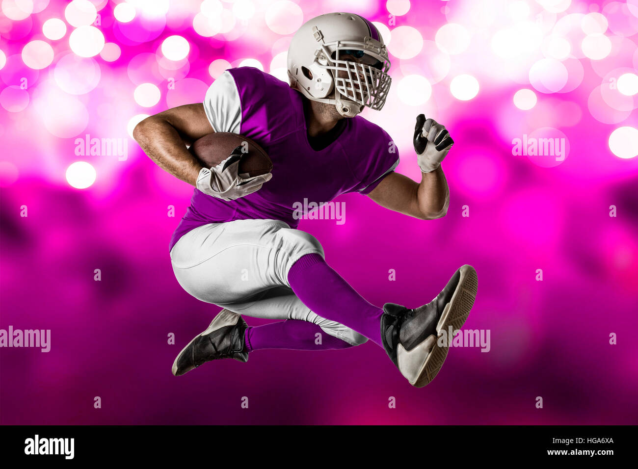 Football Player with a pink uniform Running on a pink lights background ...