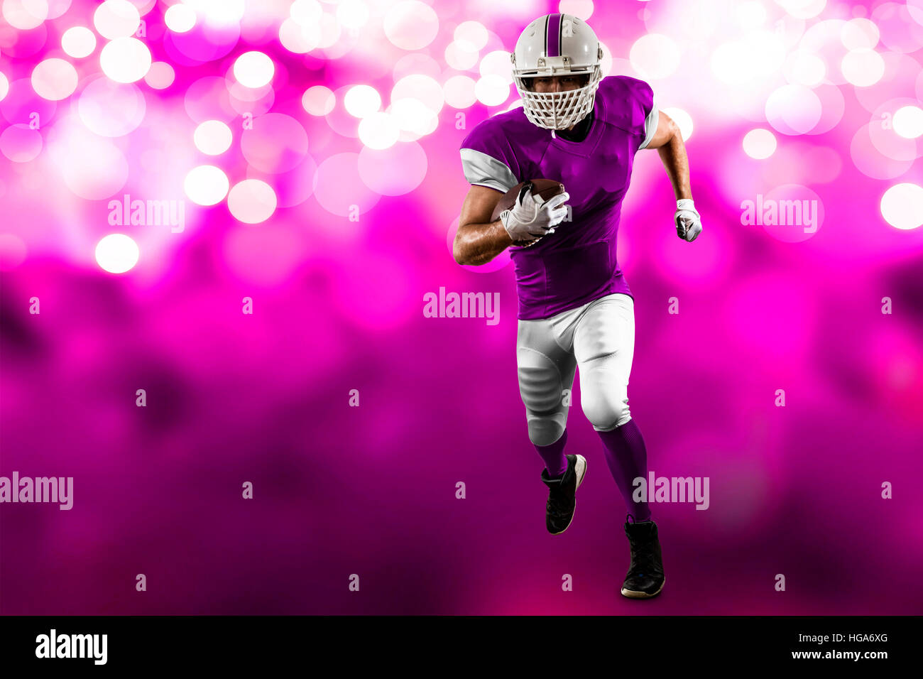 Football Player with a pink uniform Running on a pink lights background ...