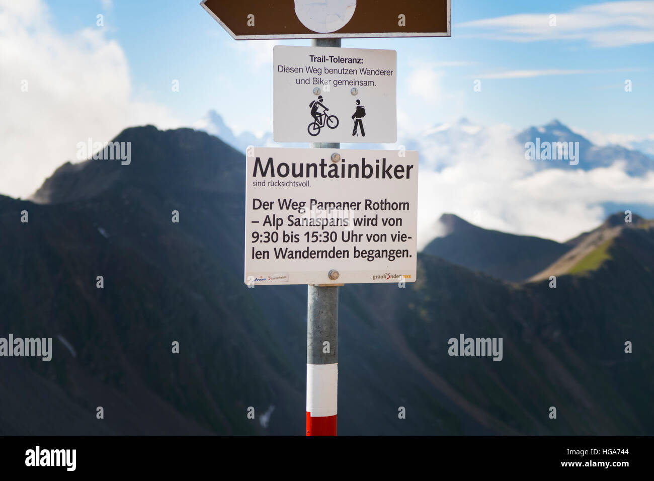 A sign says that hikers and bikers have to respect each other on the ...